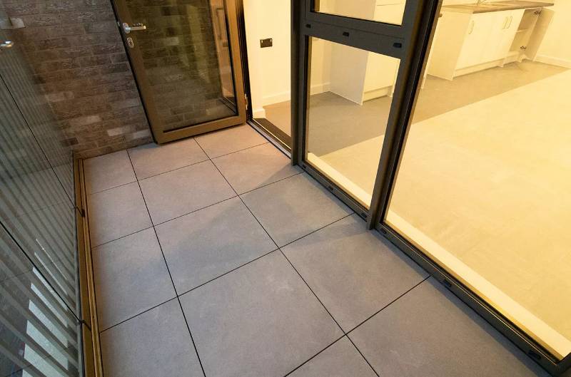 Thrayle House Balcony Paving | EnviroBuild Materials Ltd | NBS Source